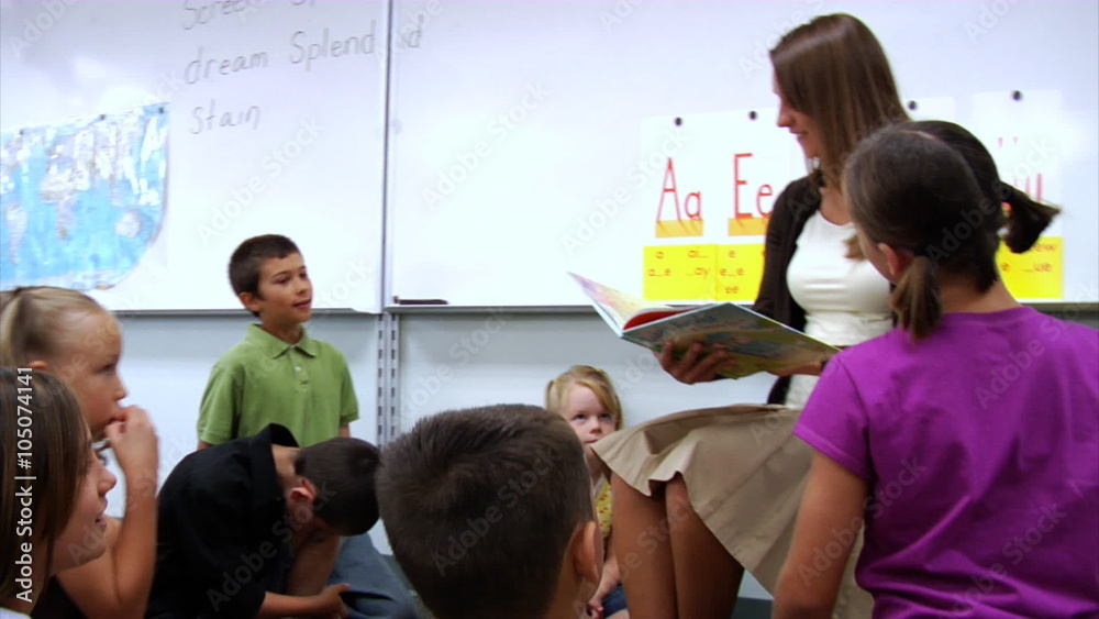Teacher reading to students Stock Video | Adobe Stock