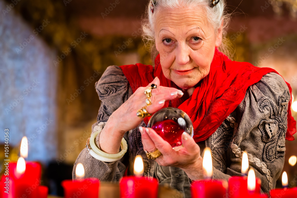 Soothsayer during session with crystal ball Stock Photo | Adobe Stock