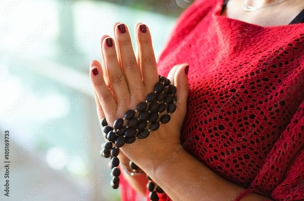 Women hand holding mala beads for meditation Stock Photo | Adobe Stock