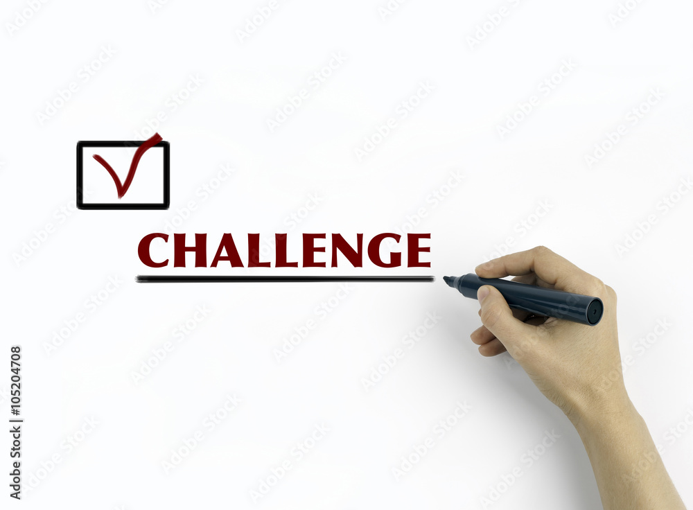 Hand with marker writing Check mark with challenge word Stock Photo ...