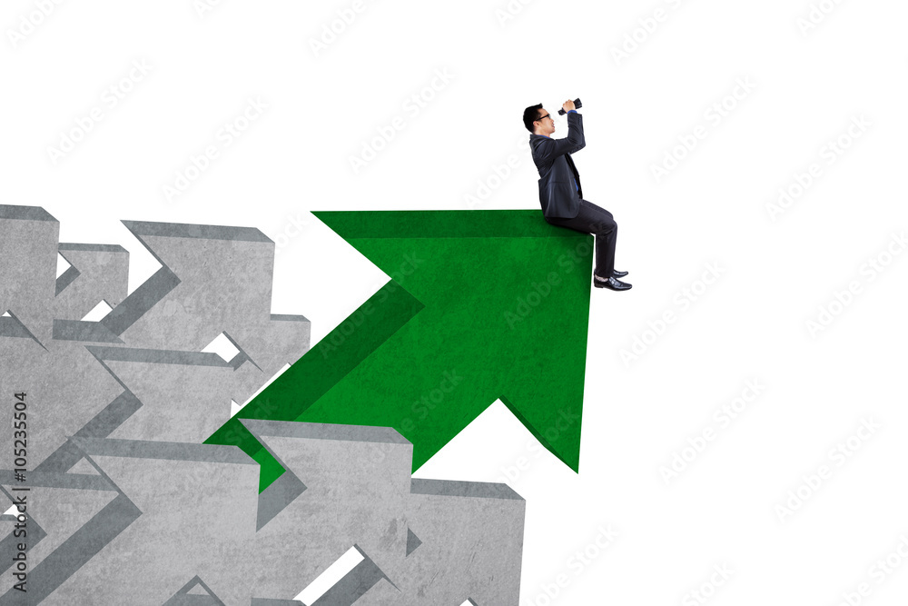 Male worker sitting on the arrow Stock Photo | Adobe Stock