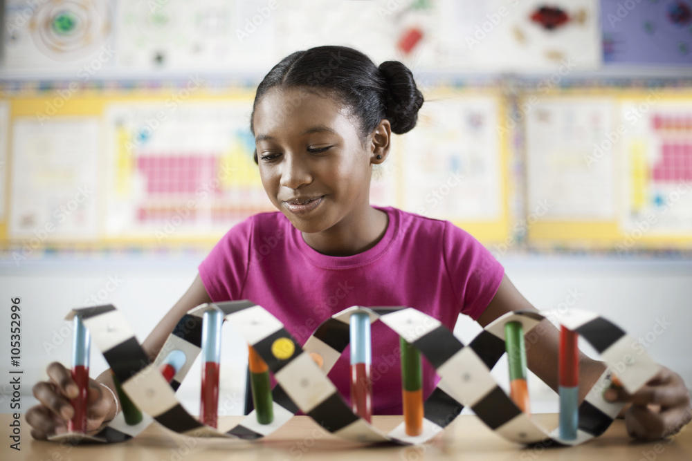 Girl in science class holding model of helix structure Stock Photo ...