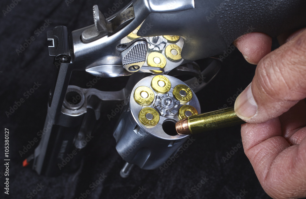 Man Loading Magnum Revolver Gun Stock Photo | Adobe Stock