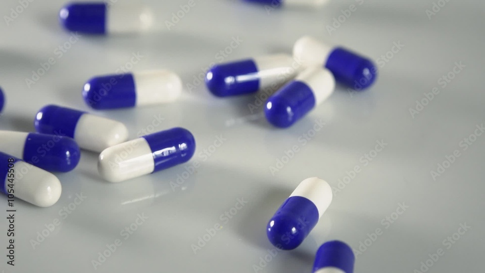 Falling Capsules Medication Pills. Encapsulation refers to a range of ...