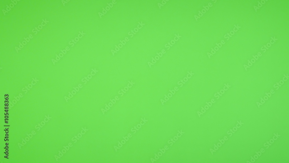 Shiny soap bubbles flying from left to right in front of green screen ...