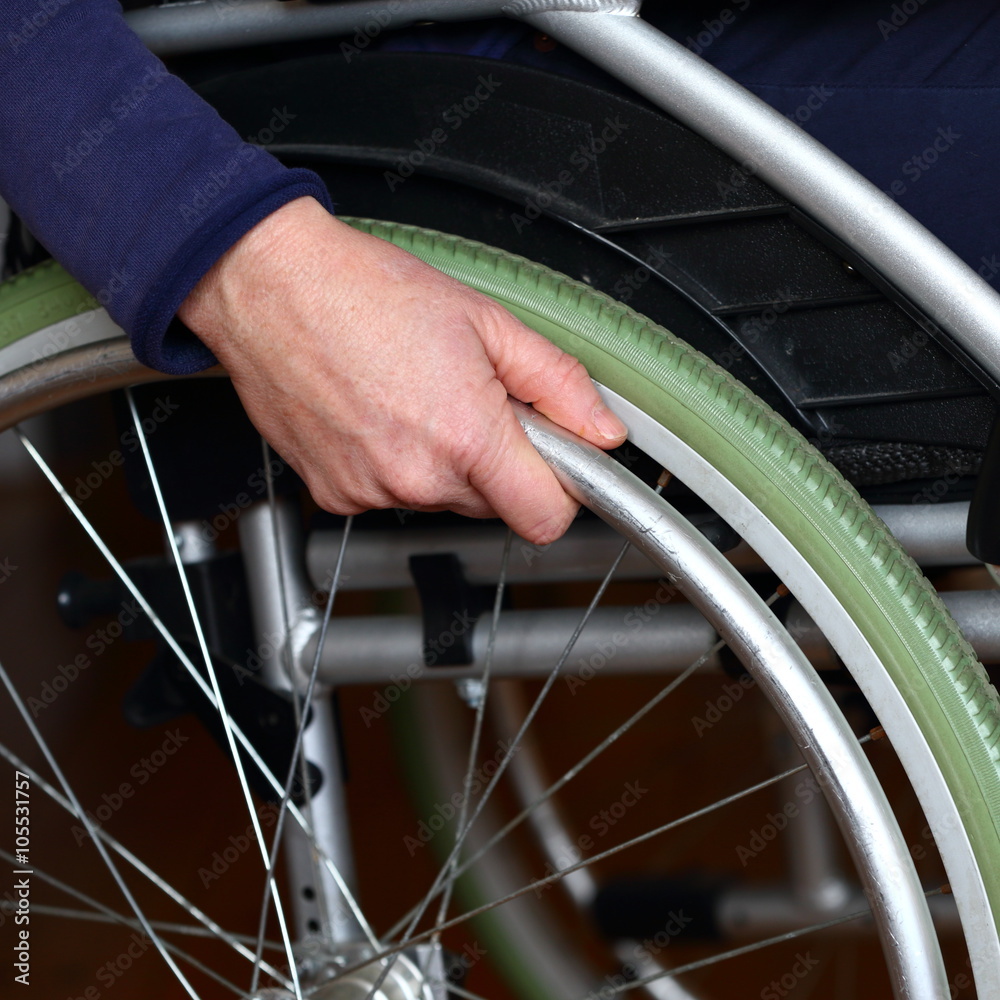 wheelchair/ hand on a wheelchair Stock Photo | Adobe Stock