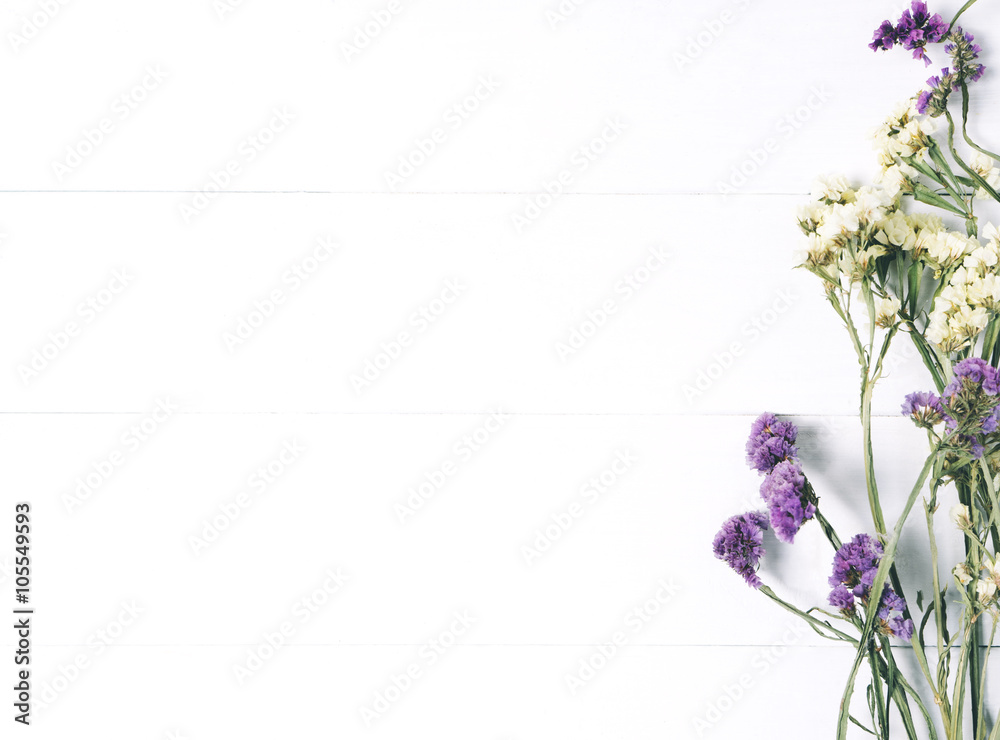 Bouquet of dried wild flowers on white table background with natural ...
