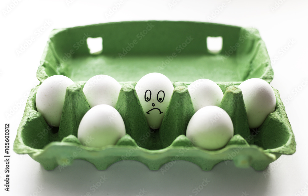 Sad Egg Face in Green Carton Stock Photo | Adobe Stock