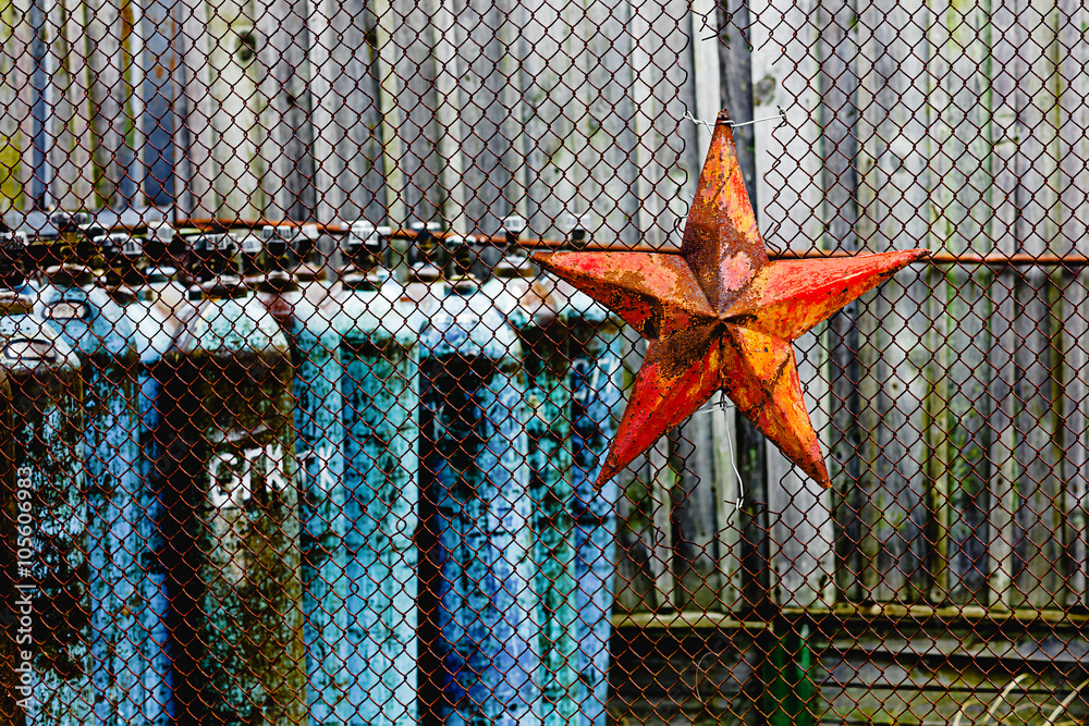 Blue rusty industrial oxygen cylinders in group behind the rusty mesh ...