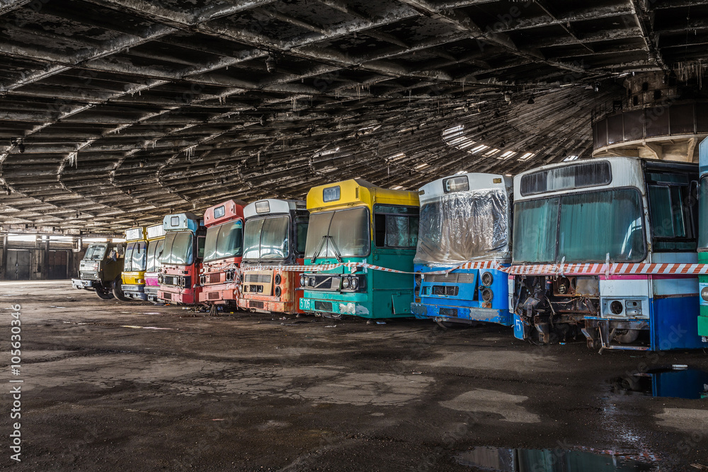 Colored buses in abandoned bus depot Stock Photo | Adobe Stock