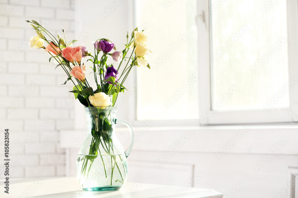 Beautiful spring flowers in vase on window background Stock Photo ...