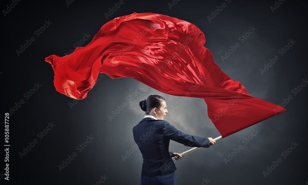 Woman waving red flag Stock Photo | Adobe Stock