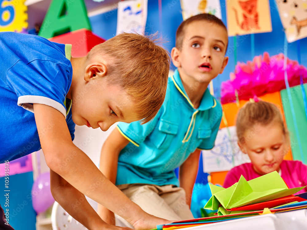 Group kids learn do origami paper airplane in kindergarten . Stock ...