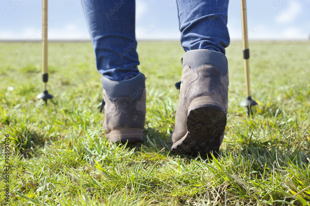 Hiking in a field Stock Photo | Adobe Stock