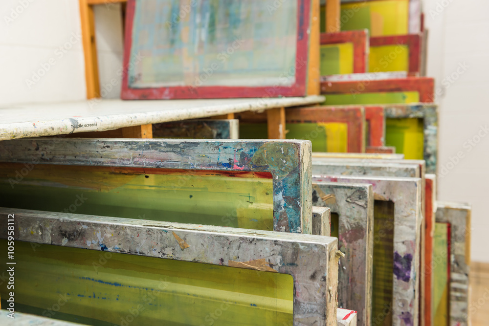 Silk screen printing screens stored in a wooden rack ready for printing ...