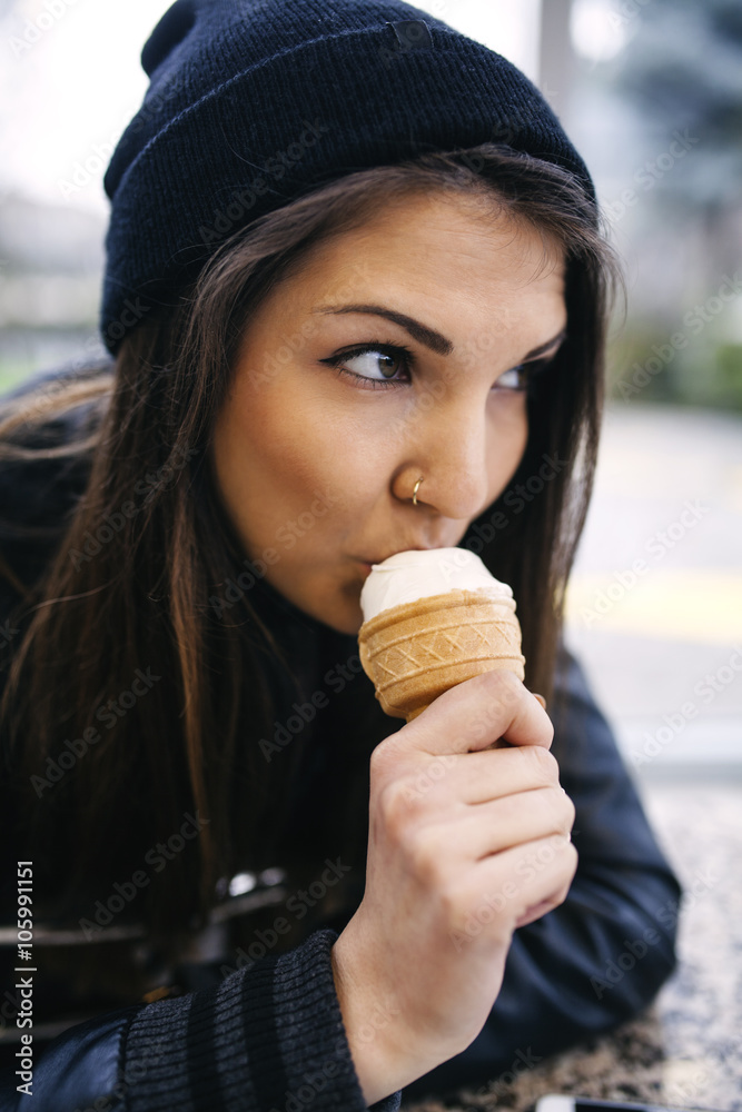 Beautiful woman eating ice cream Stock Photo | Adobe Stock