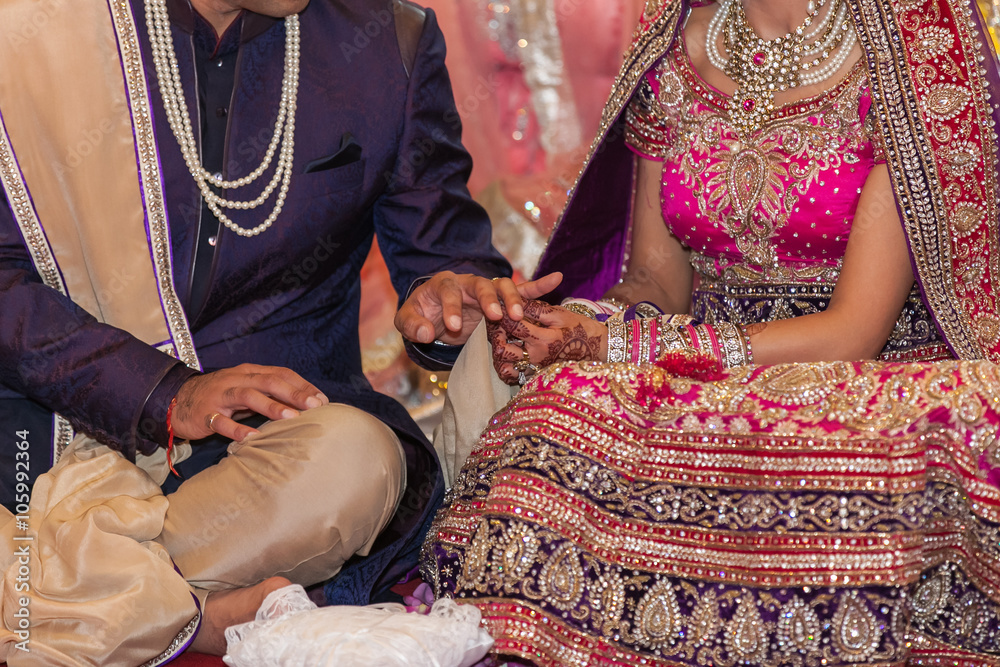 Indian bride and groom in a temple during wedding ceremony. Stock Photo ...