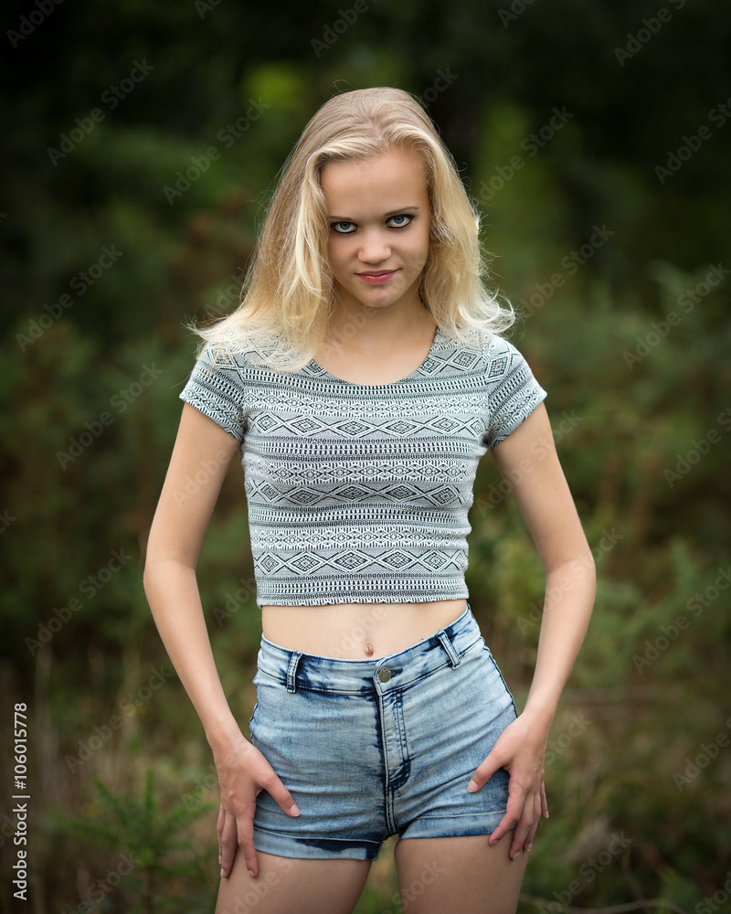Beautiful Blond Teen Showing Belly Button Photos | Adobe Stock
