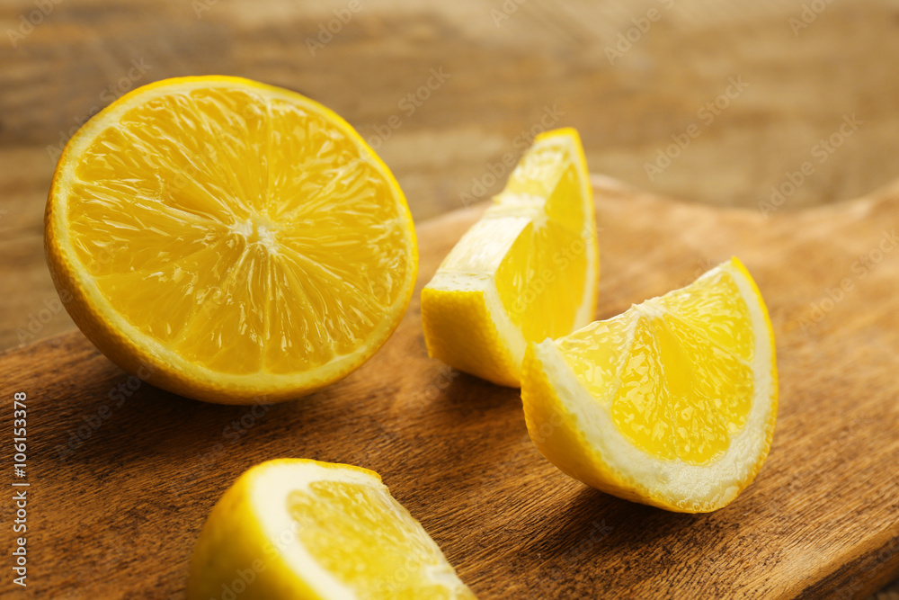Sliced fresh lemons on wooden background Stock Photo | Adobe Stock