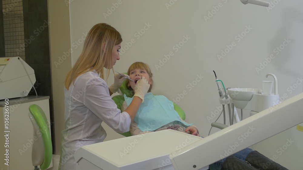 Woman Dentist is Examining a Teeth With Mirror Patient Teenage Girl is ...