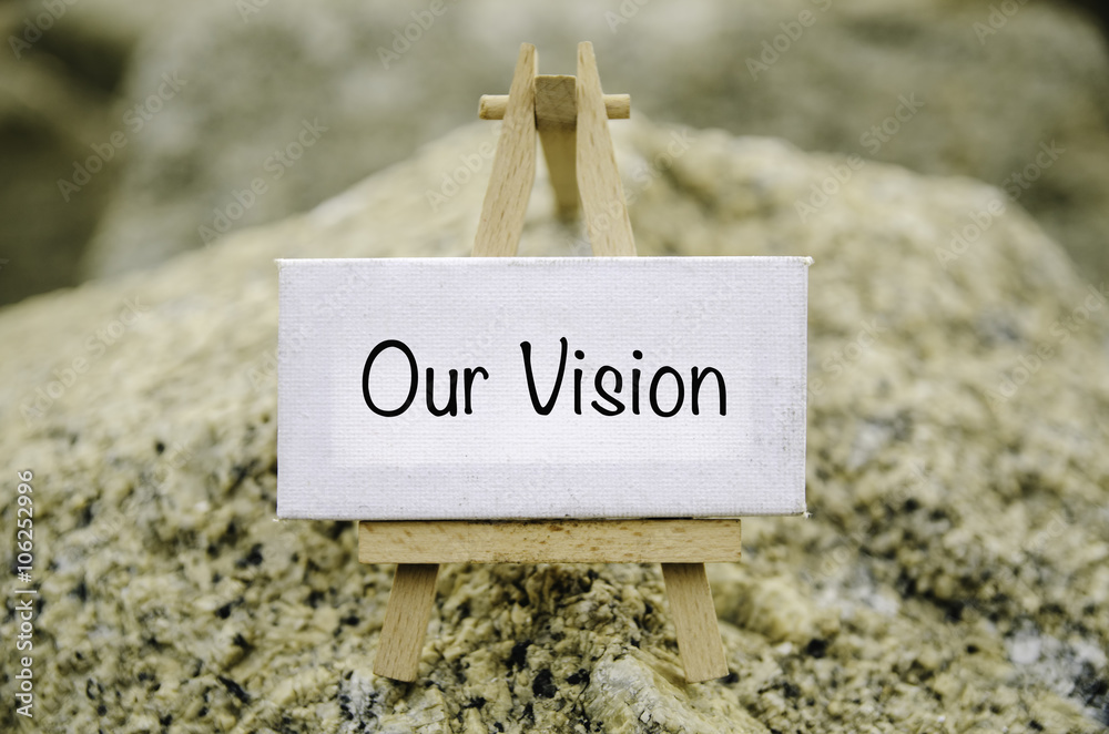 conceptual image, word OUR VISION white canvas frame and wooden tripod ...