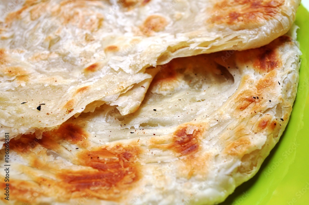 Layered paratha flatbread called Roti Canai in Malaysia Stock Photo ...
