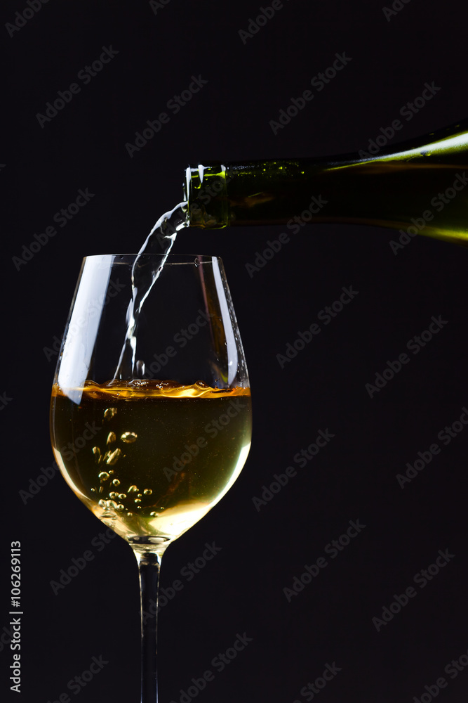 wine being poured into a wineglass Stock Photo | Adobe Stock