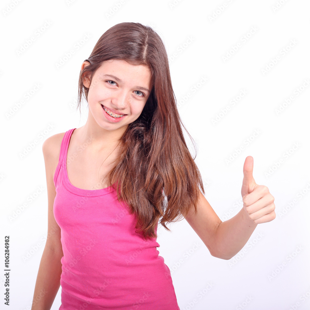 Teen beauty caucasian girl showing her thumbs up. Isolated on white ...