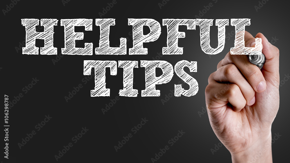 Hand writing the text: Helpful Tips Stock Photo | Adobe Stock