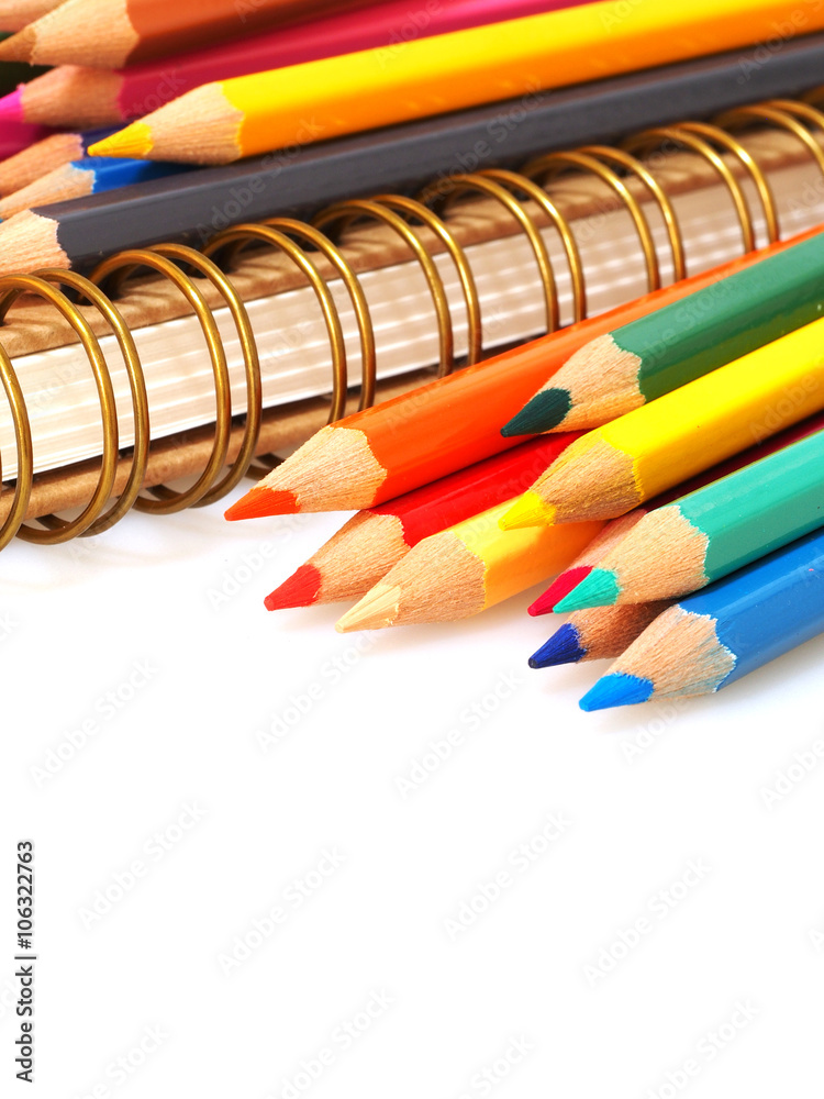 colour pencils and note book isolated on white background Stock Photo ...