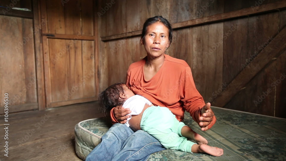 Mother and child living in impoverished conditions in the Ecuadorian ...
