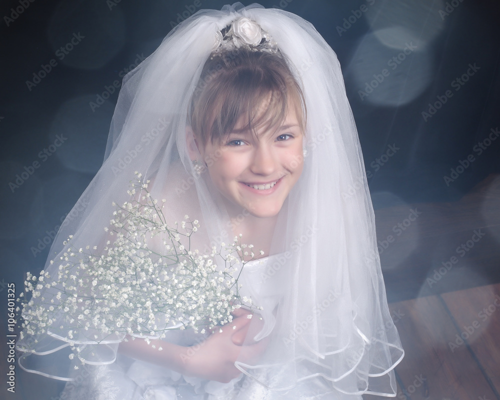 Very young bride. Wedding white dress. Luxury veil. Happy smile ...