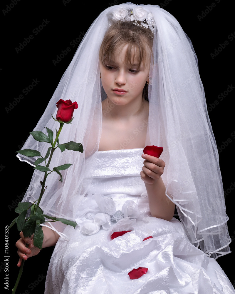 Very young bride. Wedding white dress. Luxury veil. Flower red rose ...