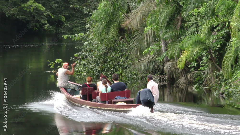 crowd of travelers navigation on cuyabeno waterway in ecuadorian ...