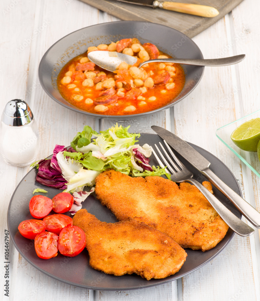 restaurant menu, breaded steak and chickpeas Stock Photo | Adobe Stock