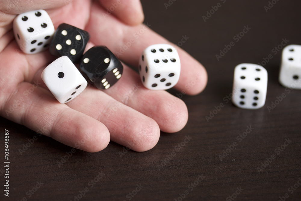 Dice in the hand of man. Throwing the dice during the game. Cubes of ...