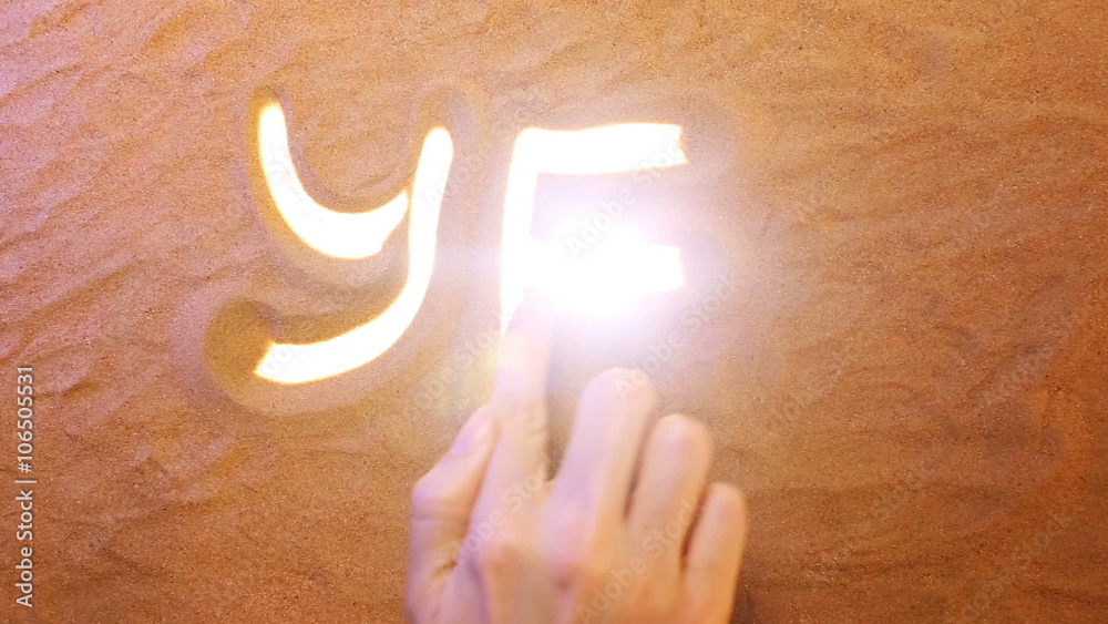 Hand drawing Yes Symbol in the Sand. Beach background. Top view ...