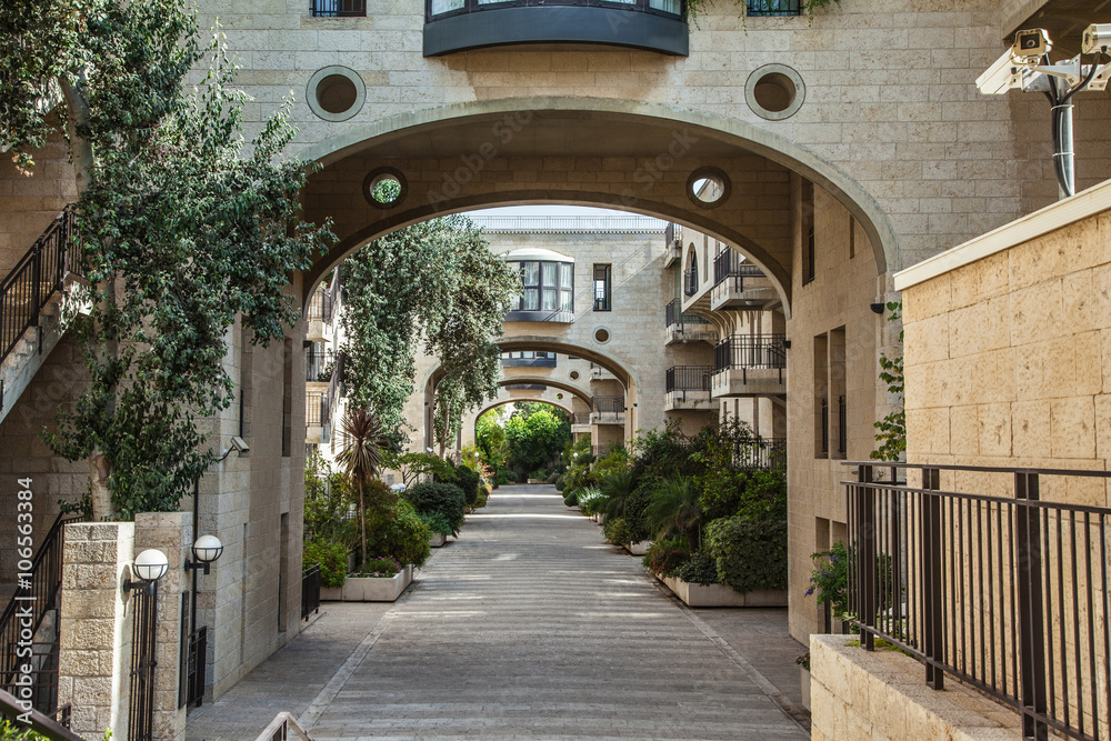 Elegant arched passageway between buildings Stock Photo | Adobe Stock