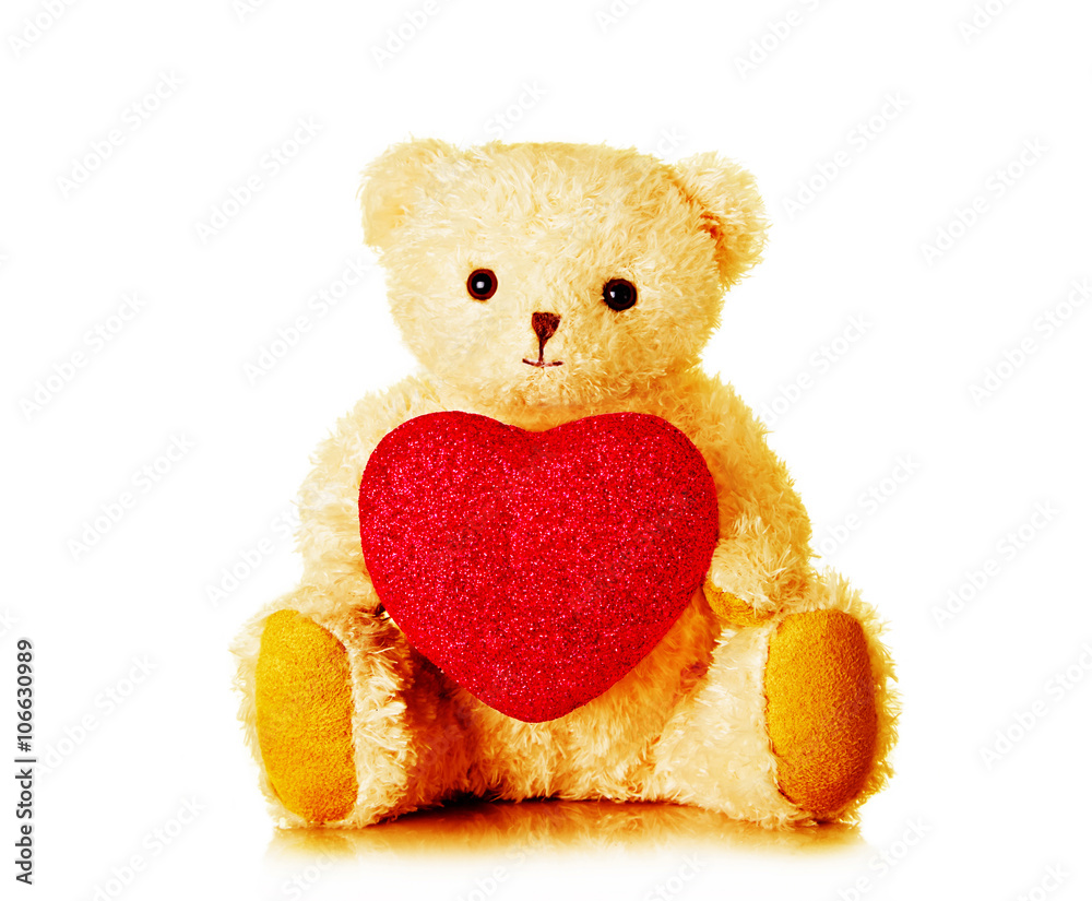 Teddy bear holding red heart Isolated on white. Stock Photo | Adobe Stock