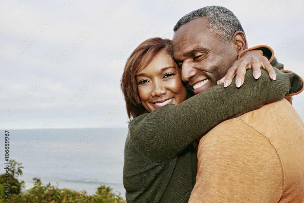 Black couple hugging outdoors Stock Photo | Adobe Stock