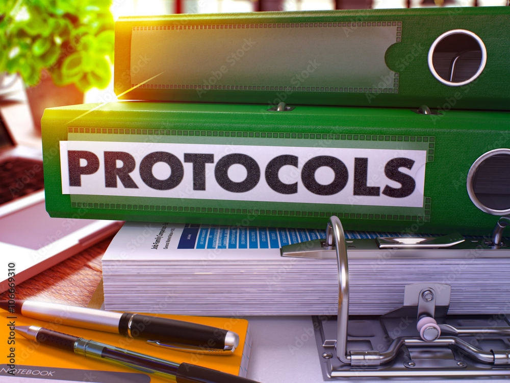 Protocols - Green Office Folder on Background of Working Table with ...