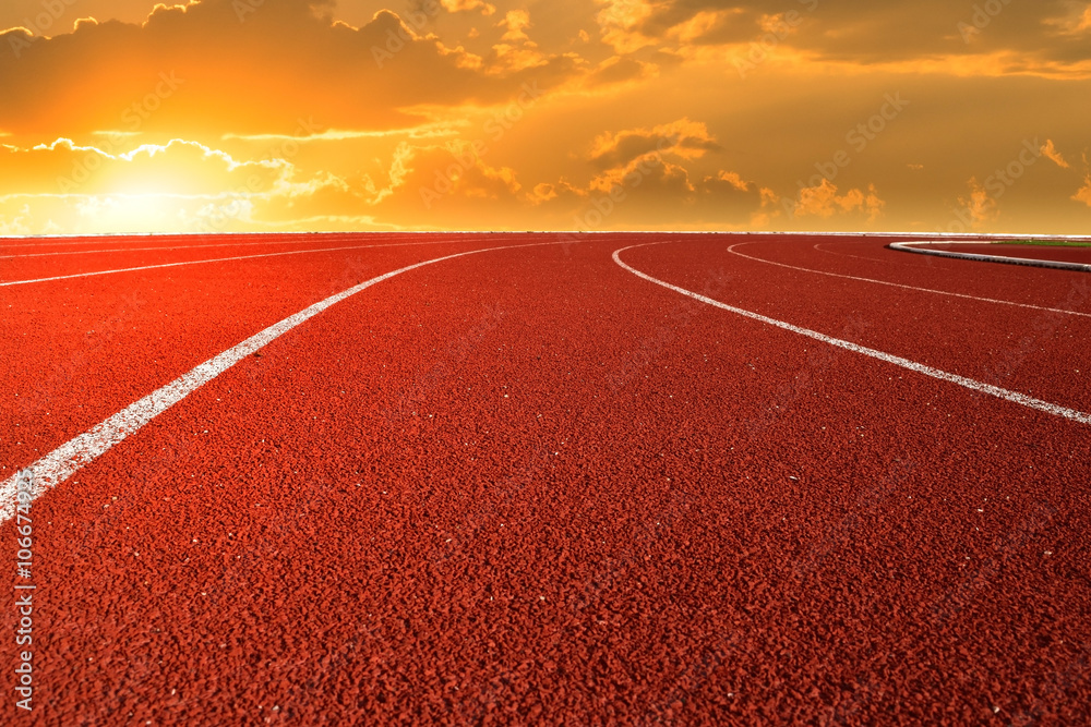 Athletics Stadium Running track curve and sunlight on orange sky Stock ...