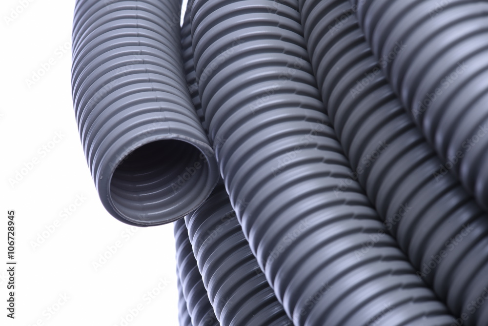 Corrugated pipe for installation of electrical cable isolated on white ...