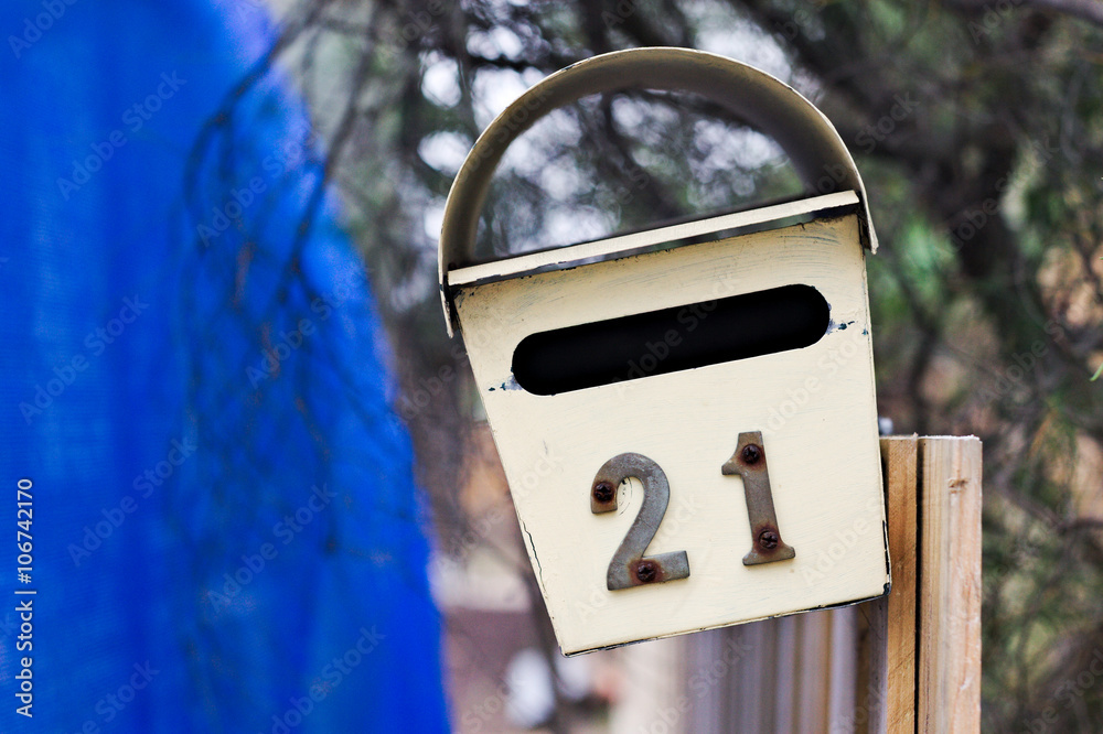 Number 21 printed on the front of a tilted/off center letterbox. Stock ...