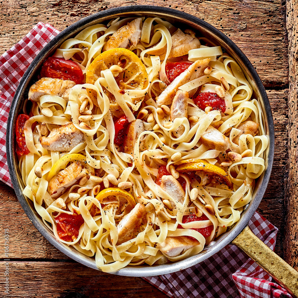 Top down view on tomato pasta lemon dish Stock Photo | Adobe Stock