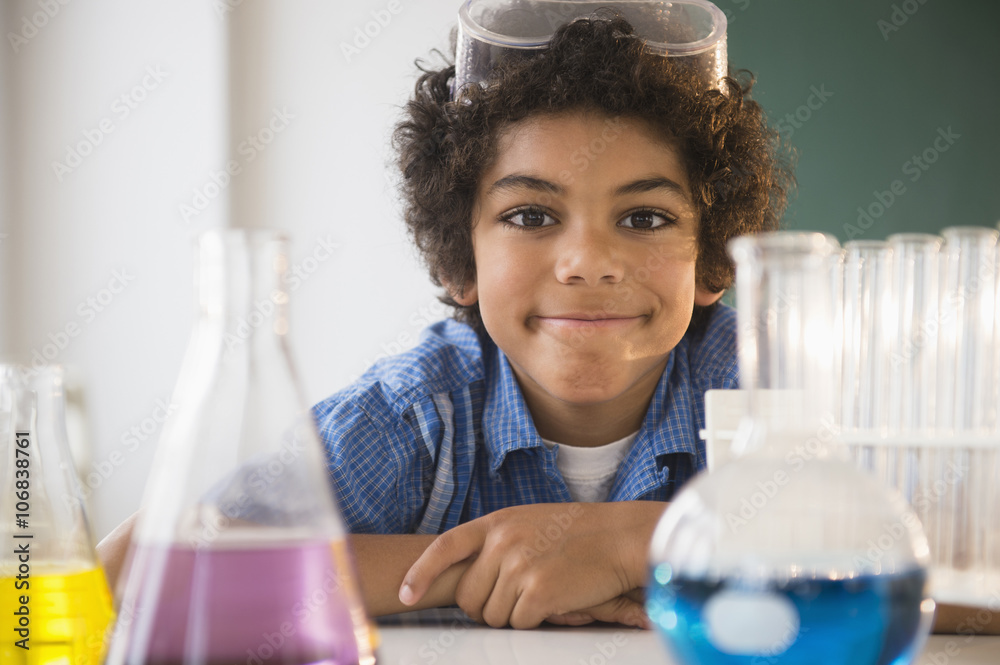 Boy sitting in classroom science lab Stock Photo | Adobe Stock