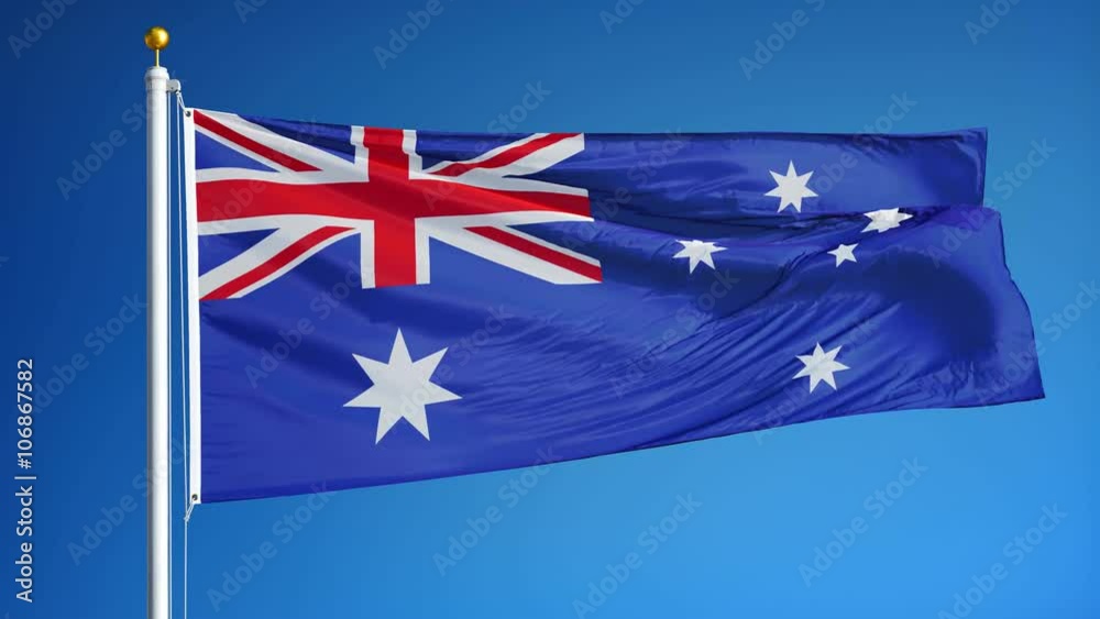 Australia flag waving in slow motion against clean blue sky, seamlessly ...
