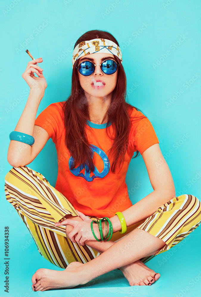 Beautiful hippy girl portrait sitting and smoking weed Stock Photo | Adobe Stock