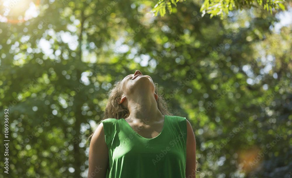 Teenage girl wearing green top looking up, Prague, Czech Republic Stock ...