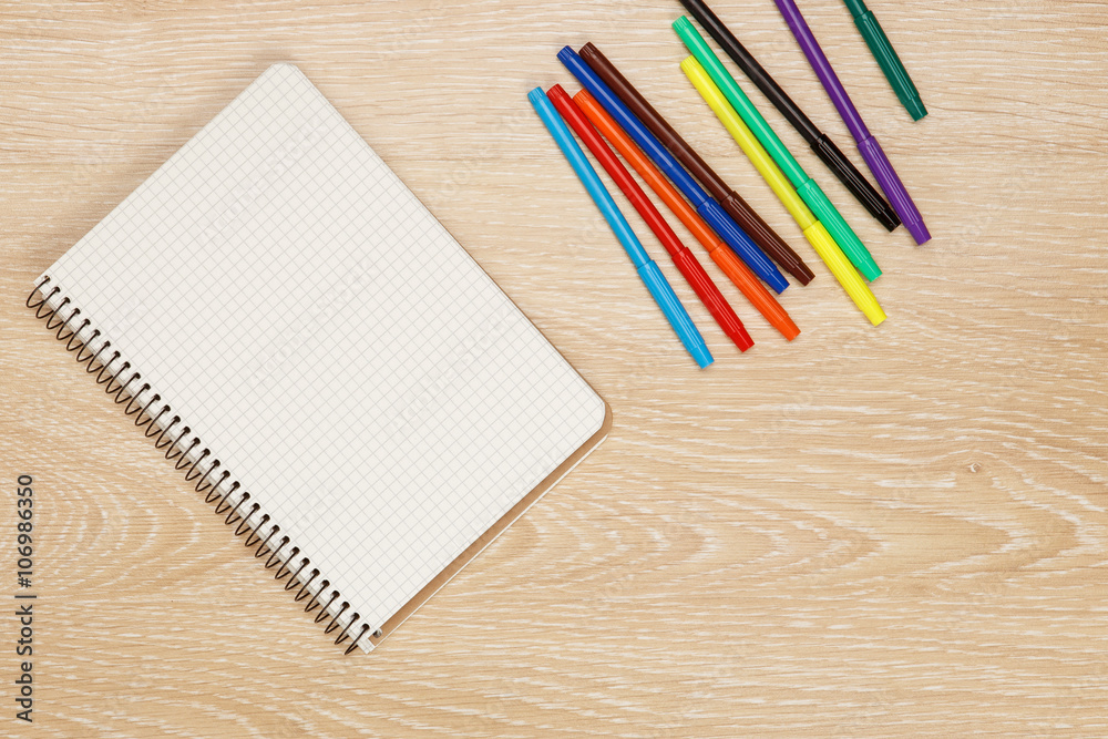 Office table with notebook and markers Stock Photo | Adobe Stock